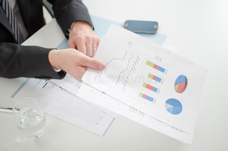 Businessman Showing Economic Documents Stock Photo - Image of ...