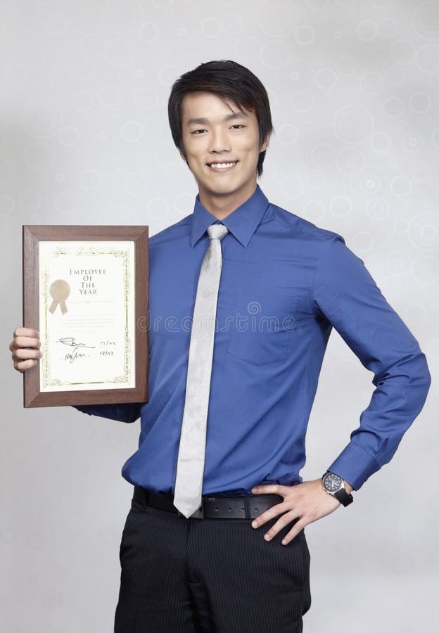 Businessman Showing Off His Certificate. Conceptual Image Stock Photo ...