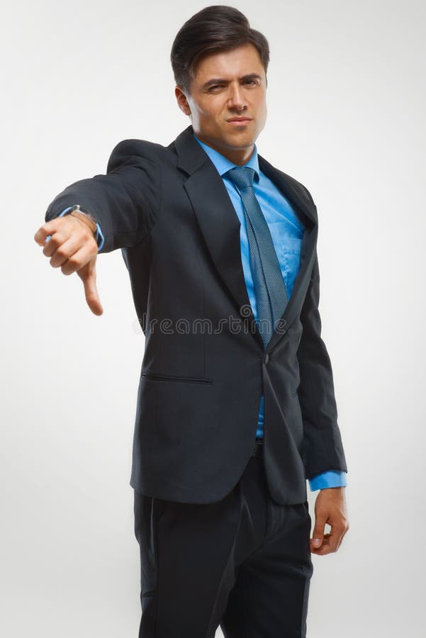 Businessman Showing Thumbs Down Sign on White Background Stock Photo ...