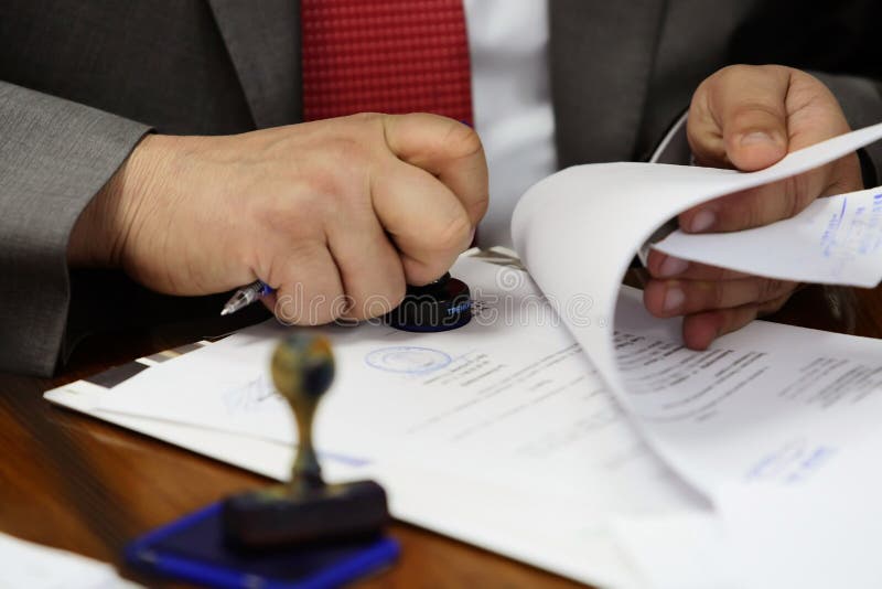 Signing of official papers stock image. Image of human - 10652329