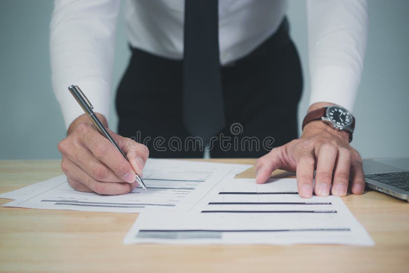 Businessman Signing Documents, Analyzing Data in Office Stock Photo ...