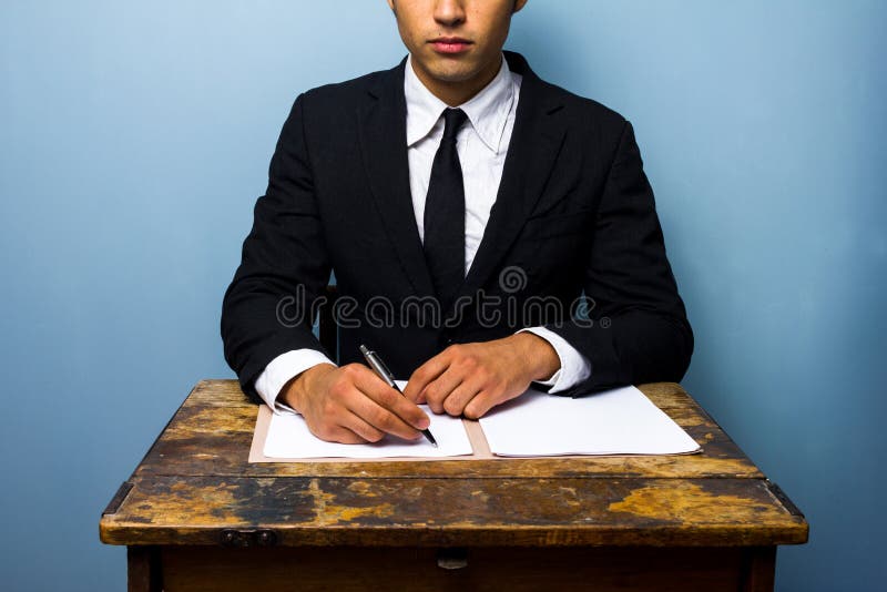 Businessman Signing Documents at Old Wooden Desk Stock Photo - Image of ...