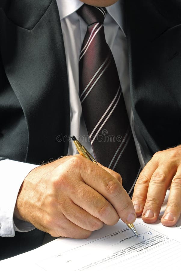 Businessman signing a form stock photo. Image of filling - 4645252