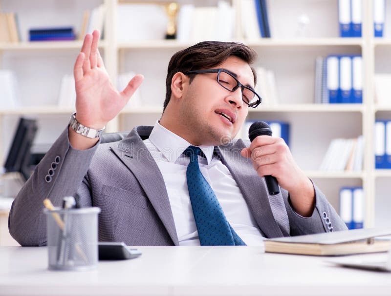 Businessman Singing in the Office Stock Photo - Image of busy, business ...