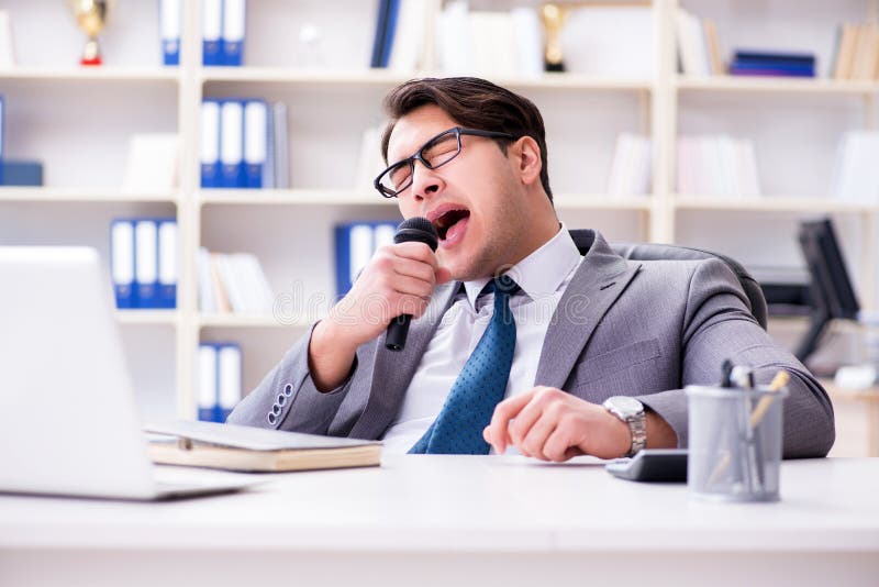 The Sad Businessman Singing in Office Stock Photo - Image of microphone ...