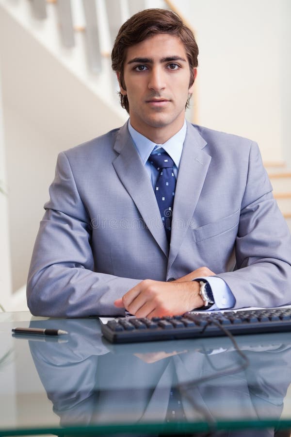 Businessman Sitting Behind His Desk Stock Image - Image of interior ...