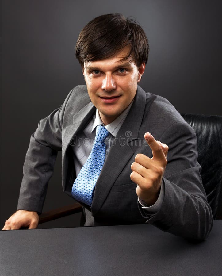 Businessman Sitting Behind His Desk Stock Image - Image of occupation ...