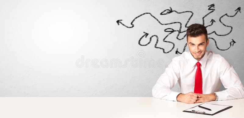 Businessman Sitting at Desk with Arrows Around Stock Photo - Image of ...