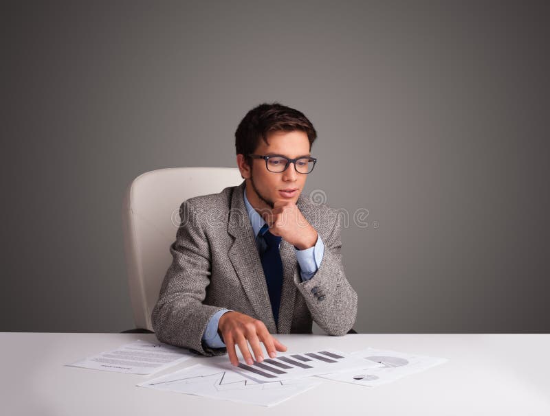 Businessman Sitting at Desk and Doing Paperwork Stock Photo - Image of ...