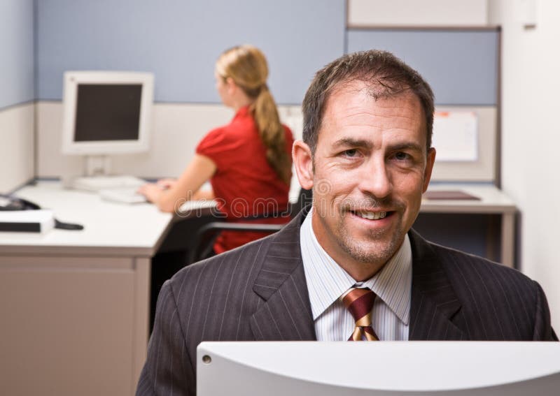 Businessman Sitting at Desk Smiling Stock Photo - Image of mature, glad ... Businessman Sitting at Desk Smiling Stock Photo - Image of mature, glad ...