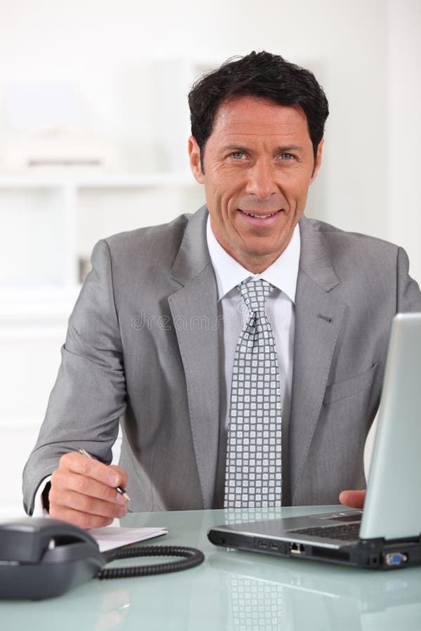 Businessman Sitting at His Desk Stock Image - Image of 4549, caucasian ...