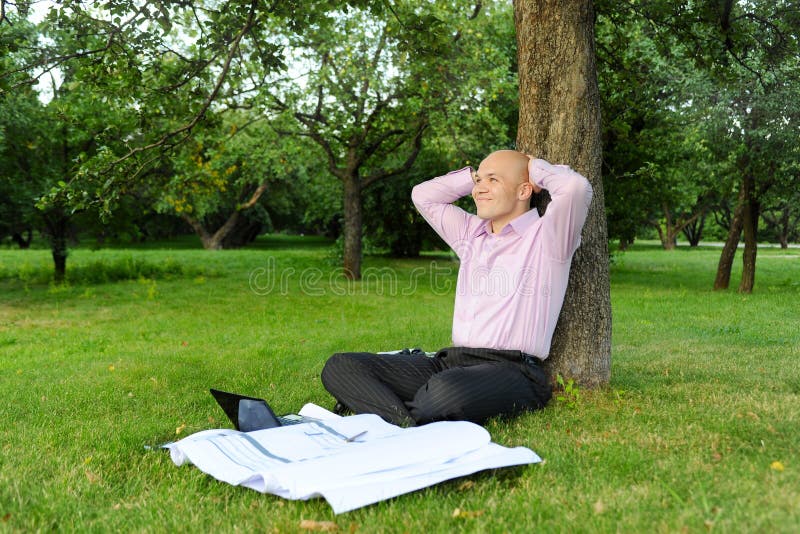 Relaxed Young Businessman Sitting on a Bench in a Park Stock Image ...