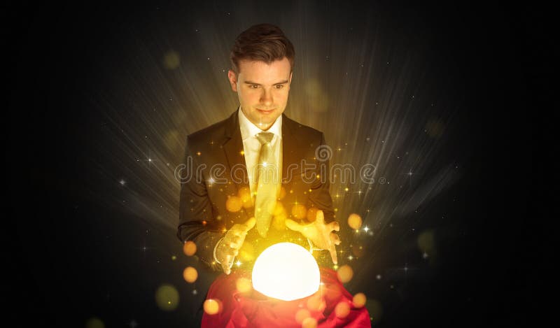 Businessman Sitting with Sparkling Magic Ball Stock Photo - Image of ...