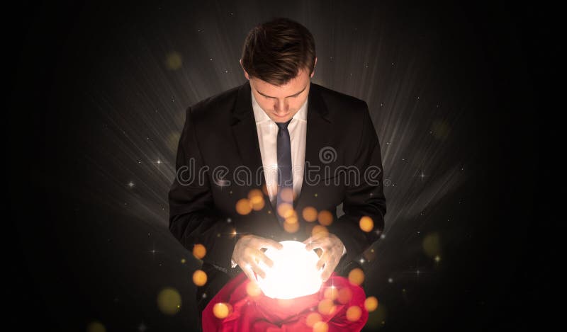 Businessman Sitting with Sparkling Magic Ball Stock Image - Image of ...