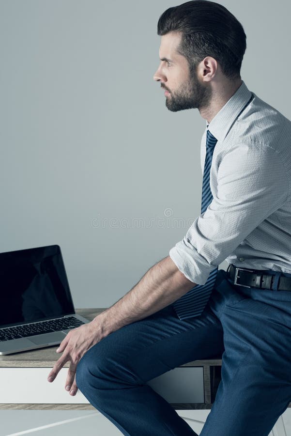 Businessman Sitting on Table Stock Photo - Image of alone, caucasian ...