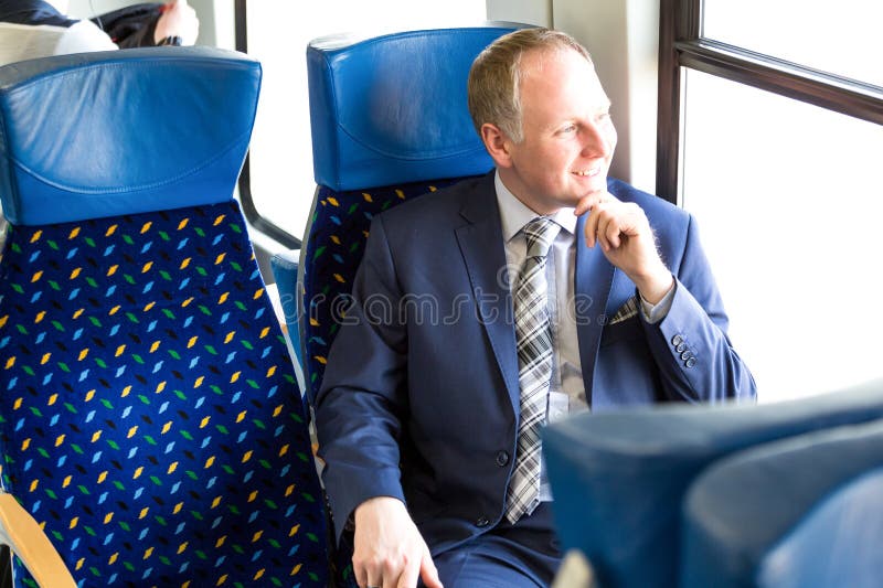 Businessman Sitting in a Train Stock Image - Image of outside, blue ...
