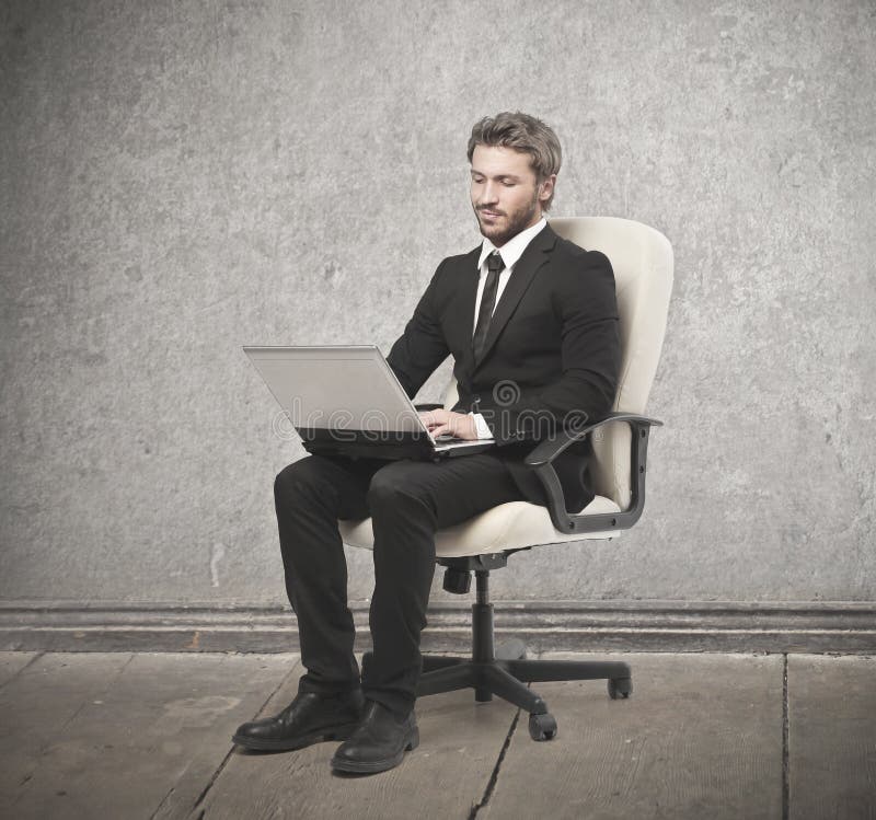 Man Sitting on a White Armchair Stock Photo - Image of work, smile ...