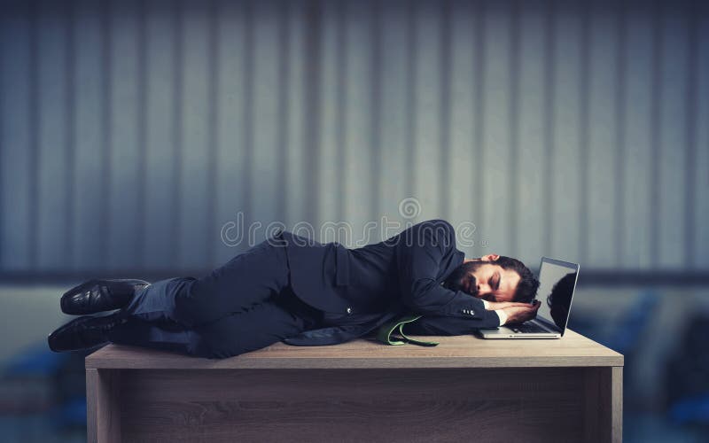 Businessman Sleeping Over a Desk Due To Overwork Stock Photo - Image of ...