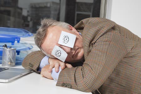 Businessman Sleeping with Sticky Notes on Eyes at Desk in Office Stock ...