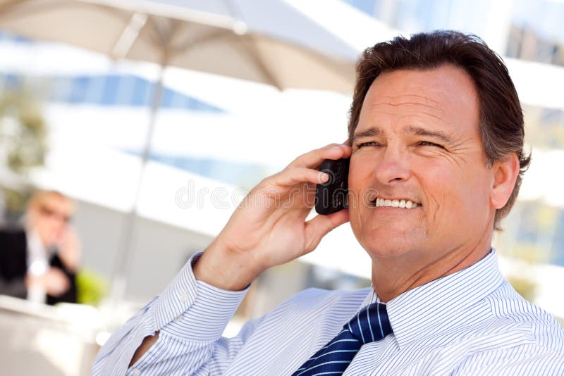 Businessman Smiles As he Talks on His Cell Phone Stock Image - Image of ...