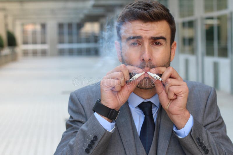 Businessman Smoking Four Cigarettes Simultaneously Stock Photo - Image ...