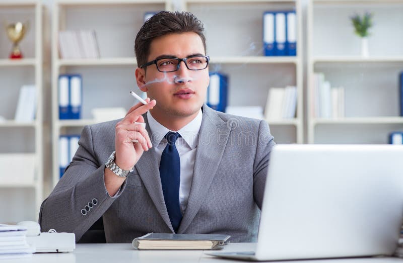 Businessman Smoking in Office at Work Stock Photo - Image of ...
