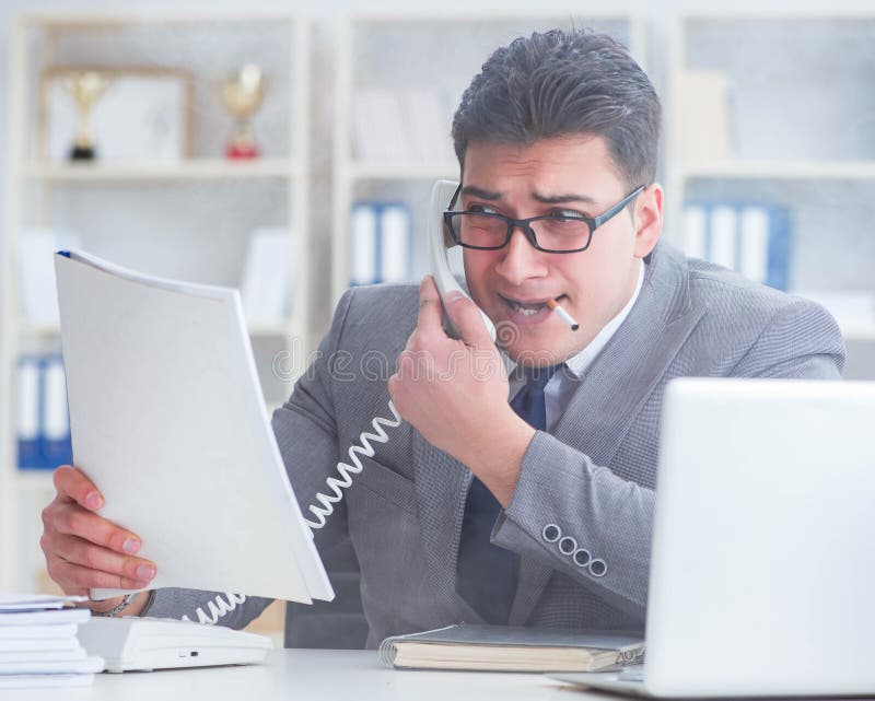 Businessman Smoking in Office at Work Stock Photo - Image of cigarettes ...