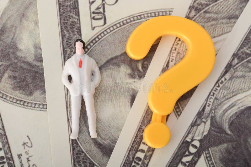 The Businessman and the Stack of Money Banknotes, a Question Mark ...