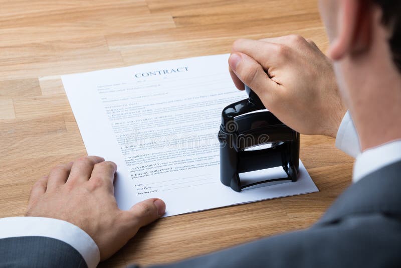 Businessman Stamping Cheque Stock Photo - Image of check ...