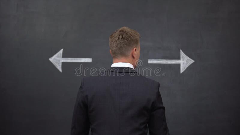 Businessman Standing Between Arrows Showing Different Directions Back