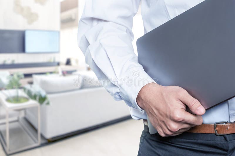 Businessman Standing while Carrying the Laptop Working from Home Stock ... Businessman Standing while Carrying the Laptop Working from Home Stock ...
