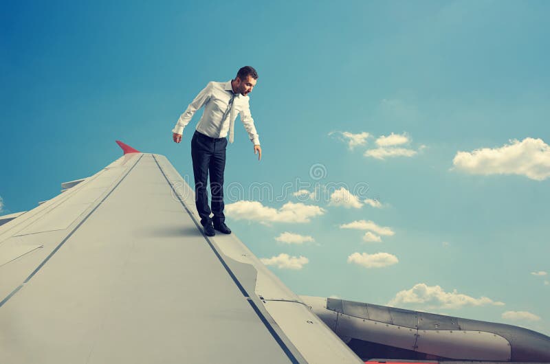 Businessman Standing on Edge of the Wing Stock Image - Image of ...