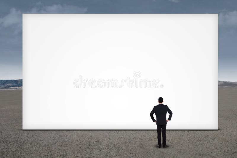 Businessman Standing in Front of Empty Board Stock Photo - Image of ...