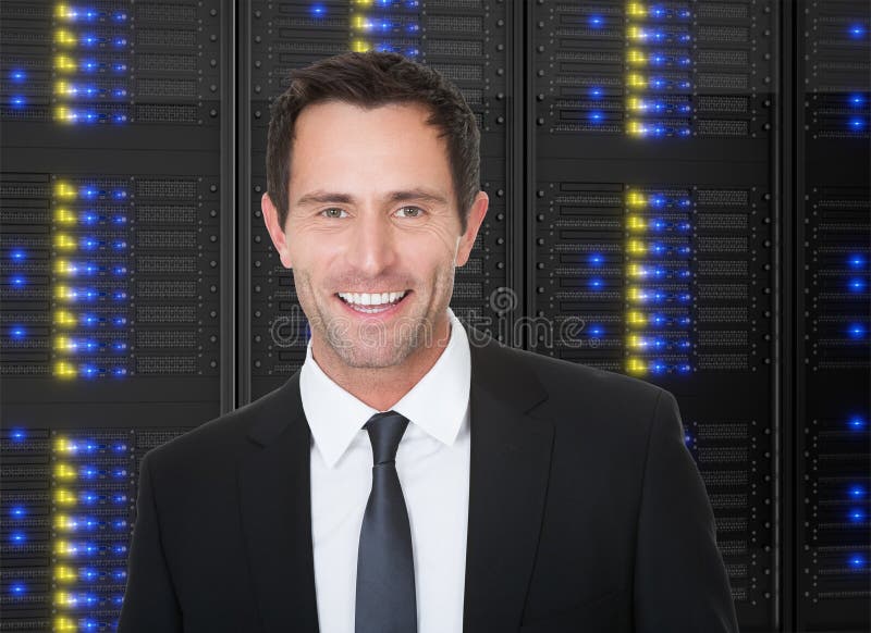 Businessman Standing in Front of Server Racks Stock Photo - Image of ...