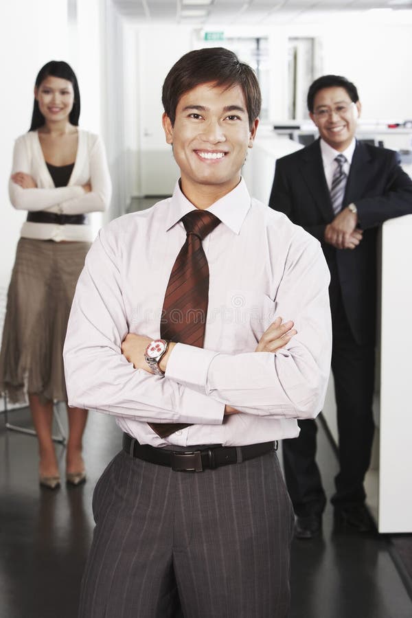 Businessman Standing in Front of Team Stock Photo - Image of caucasian ...