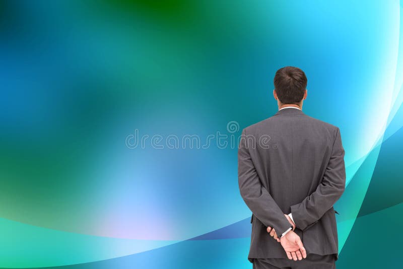 Businessman Standing with Hands Behind Back Stock Image - Image of ...