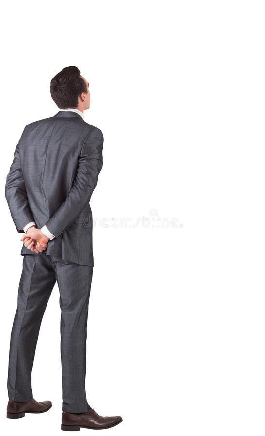 Businessman Standing with Hands Behind Back Stock Image - Image of ... Businessman Standing with Hands Behind Back Stock Image - Image of ...