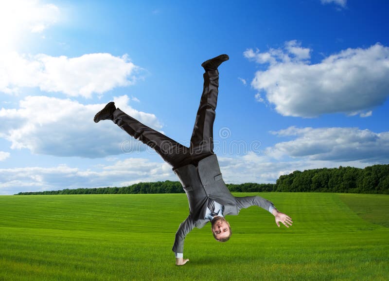 Businessman Standing on One Hand Stock Image - Image of costume ...