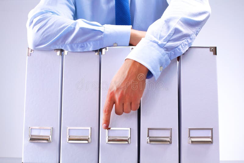 Businessman Standing Over a Folder with Documents Stock Photo - Image ...
