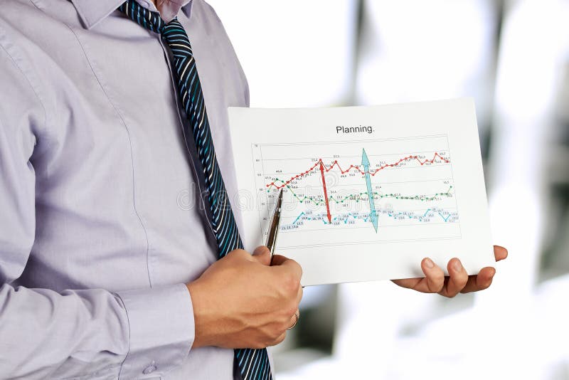 Businessman Standing and Showing Graphics. Stock Image - Image of ...