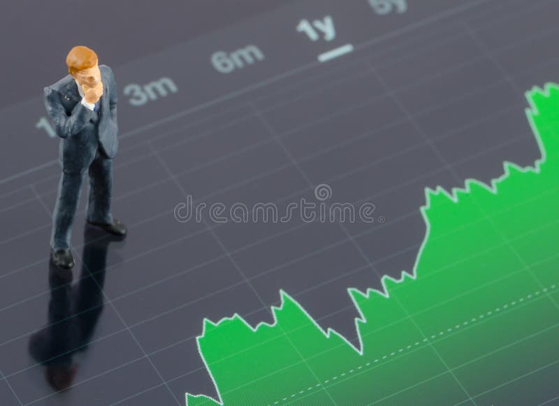 Businessman Standing on the Stock Graph in Tablet Stock Photo - Image ...