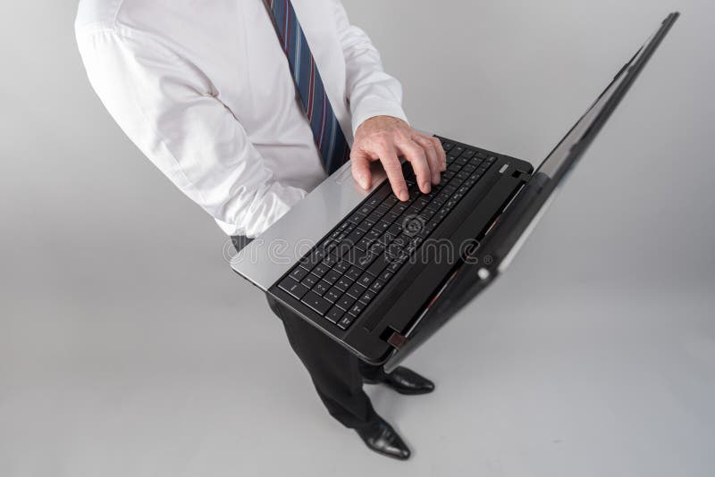 Businessman Standing and Working on His Laptop; Panoramic Banner Stock ...