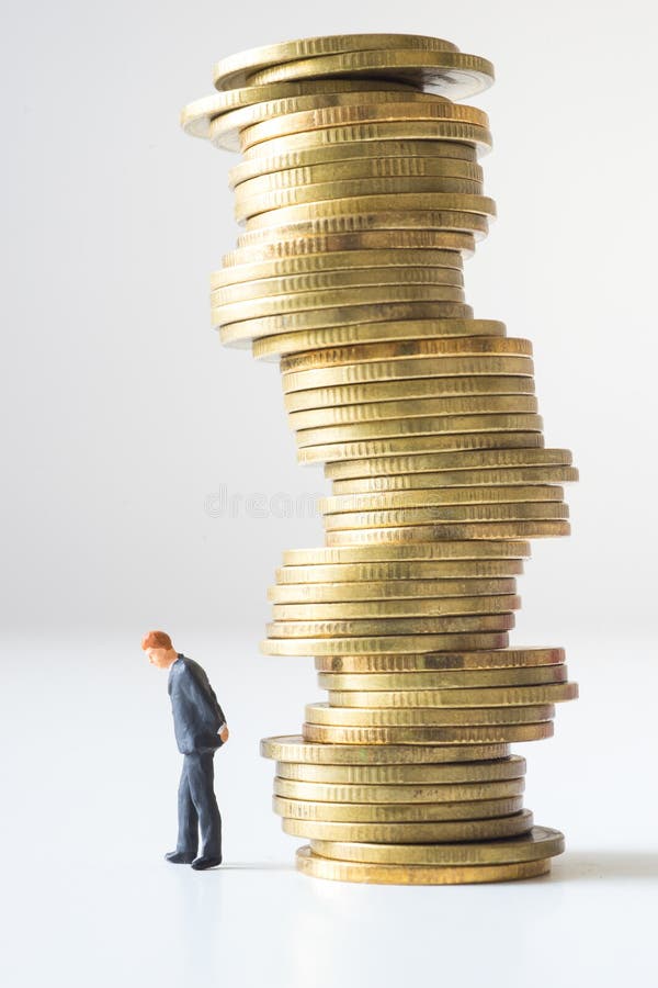 Businessman Standing Under Risky Coin Stack. Stock Photo - Image of ...