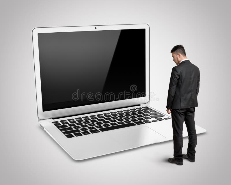 Businessman Stands in Front of an Open Laptop Looking at the Macro ...