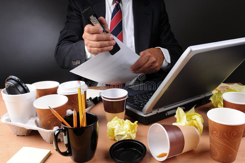 Businessman Stapling Papers at Messy Desk Stock Photo - Image of messy ...