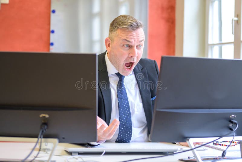 Businessman Staring at a Computer with Stupefication Stock Image ...