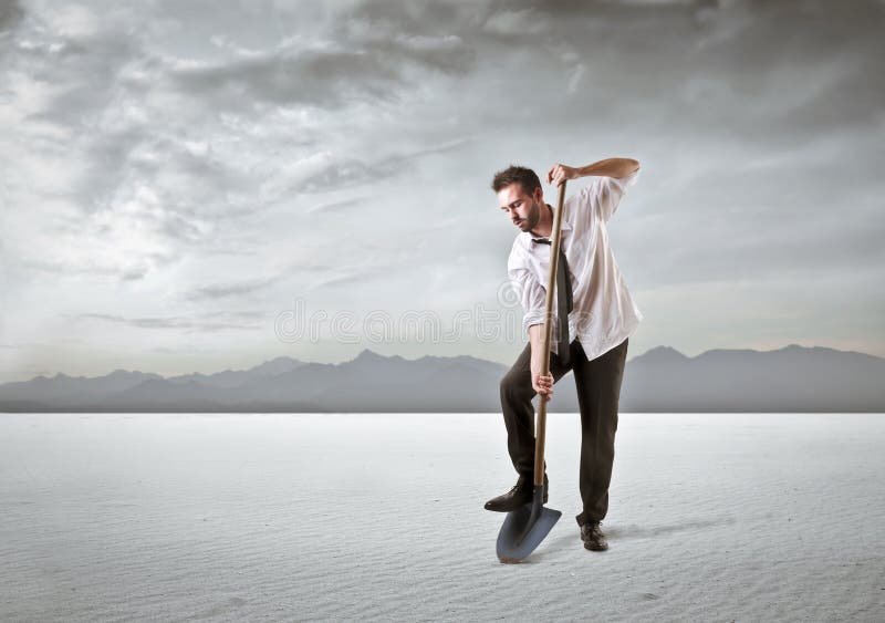 Businessman Starting To Dig Up Stock Photo - Image of ground, sand ...