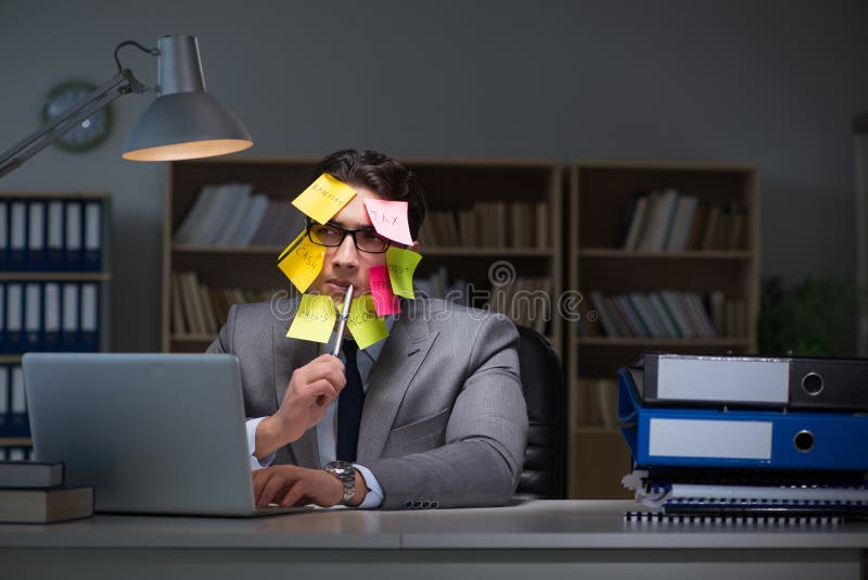 The Businessman Staying Late To Sort Out Priorities Stock Photo - Image ...