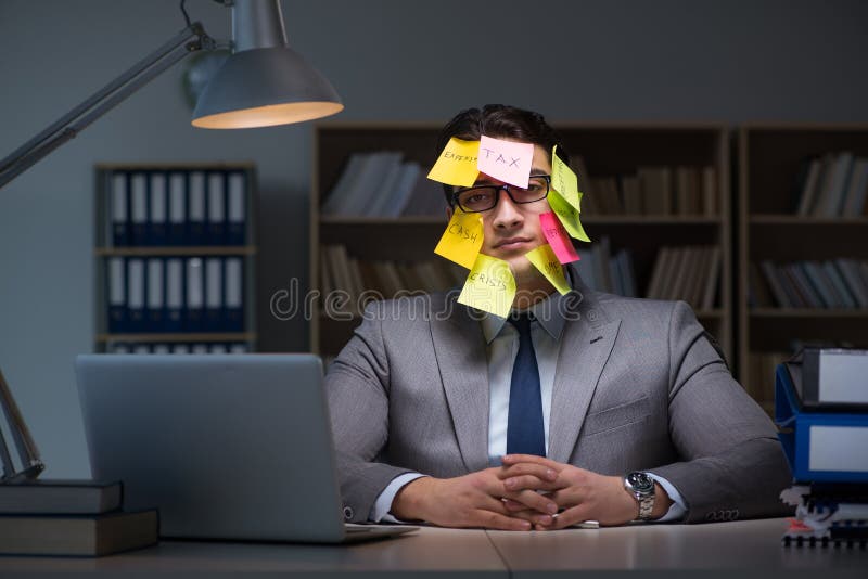 The Businessman Staying Late To Sort Out Priorities Stock Photo - Image ...