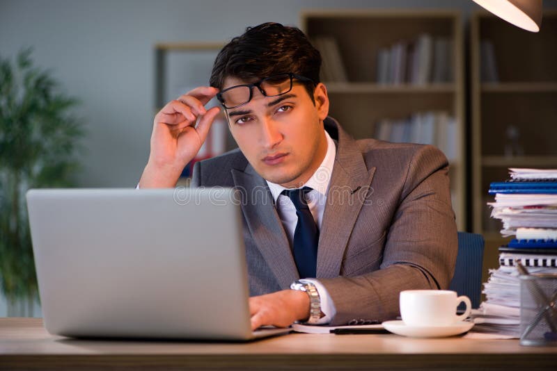 The Businessman Staying in the Office for Long Hours Stock Image ...